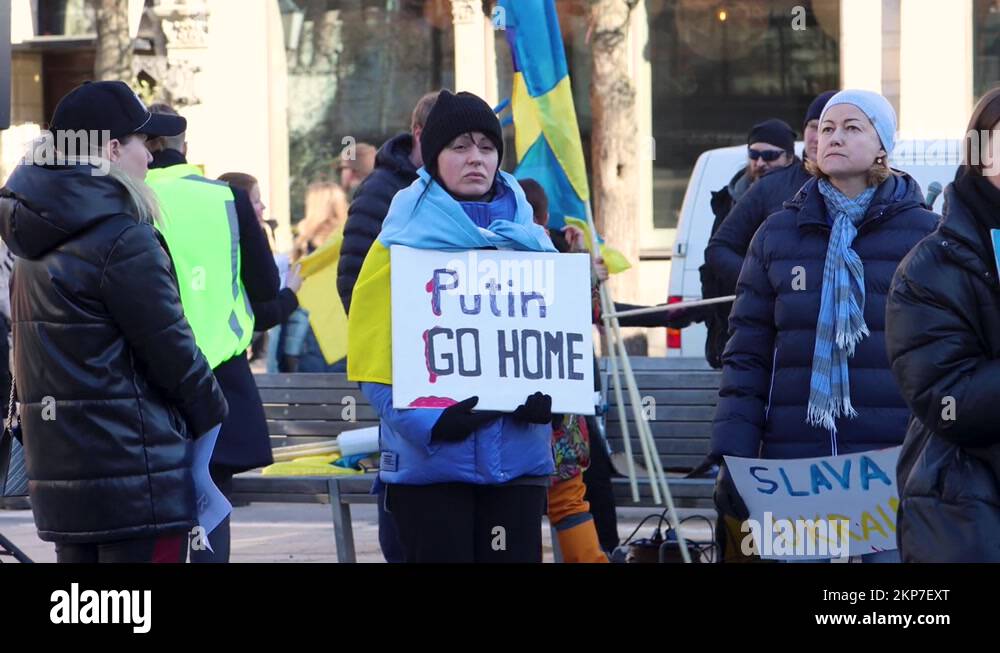 Woman with Putin Go Home-sign protests against Russian war in Ukraine ...