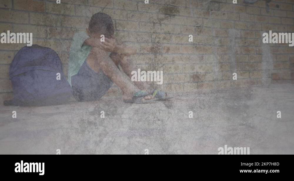 Animation of cracked texture changing over sad biracial boy sitting on ...