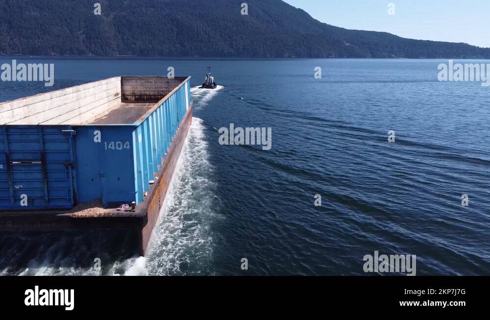 Tugboat Towing an Empty, Blue Barge on How Sound. Summer 2021 Stock ...