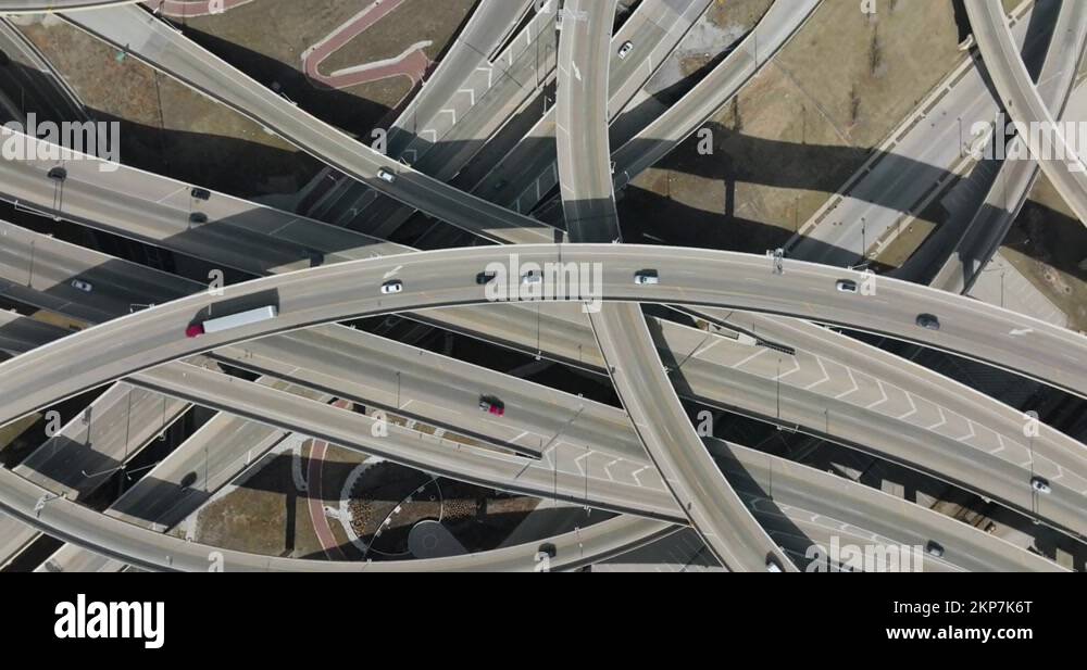Flying above massive highway intersection with multi level road ...