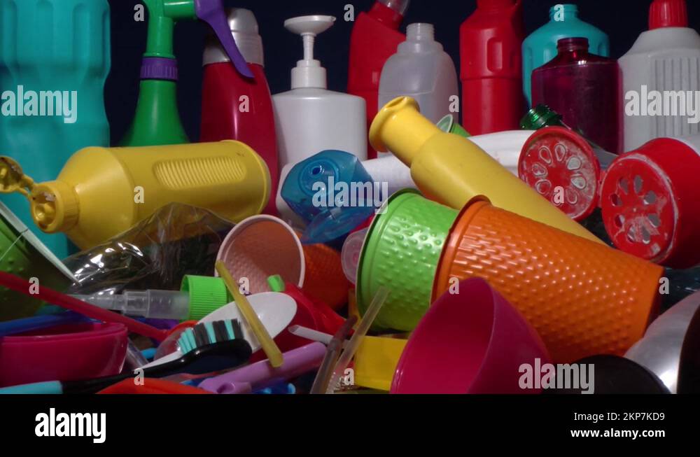 Plastic waste pollution. A pile of plastic garbage, tubes from drinks ...