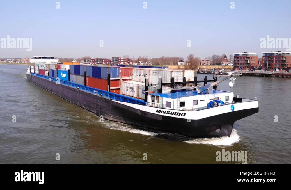 Missouri Ship Carrying Shipping Containers Along River Noord. Aerial ...