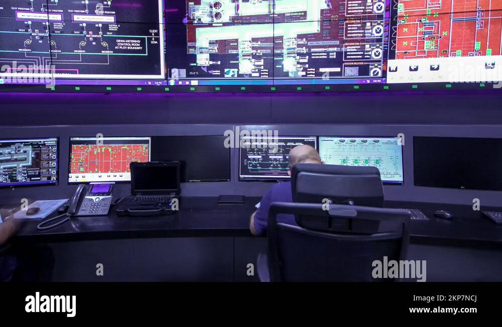 Operators working in a data center system control room offices ...