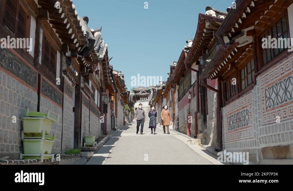 People in masks visit Bukchon Hanok Village in Seoul, South Korea ...