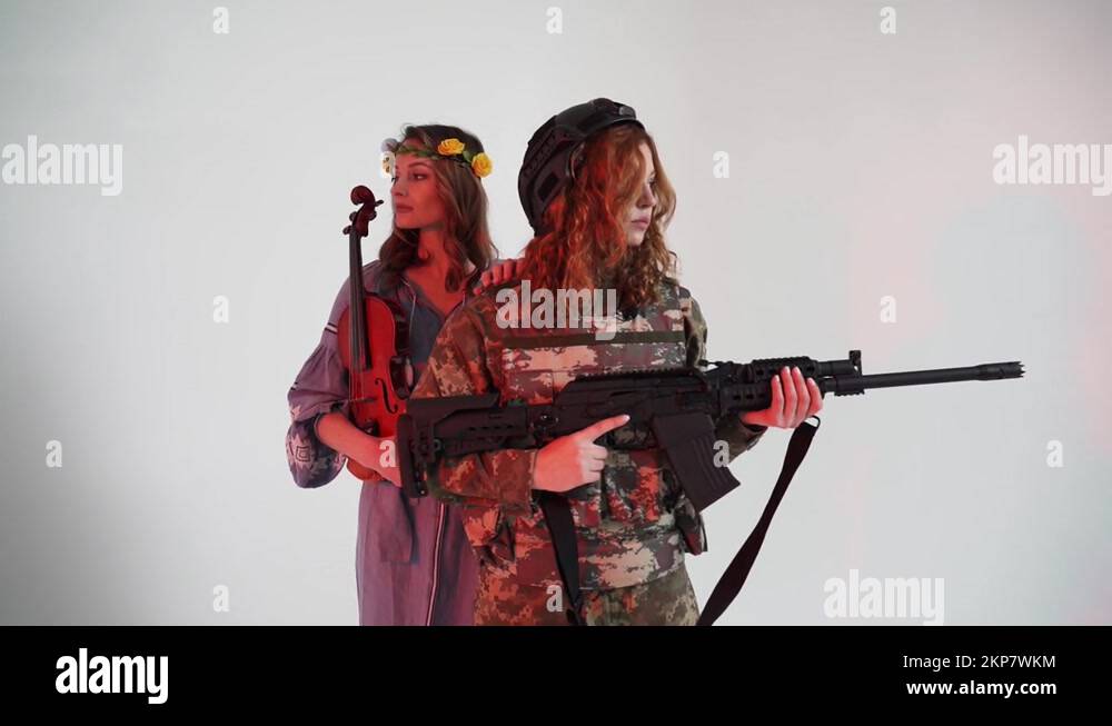 Portrait of two women from Ukraine Woman warrior with assault rifle and ...