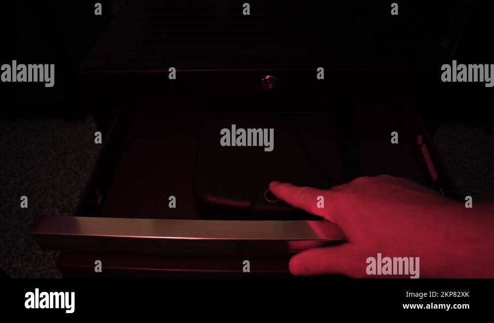 Man uses his fingerprint to open a biometric safe and pick up a handgun ...