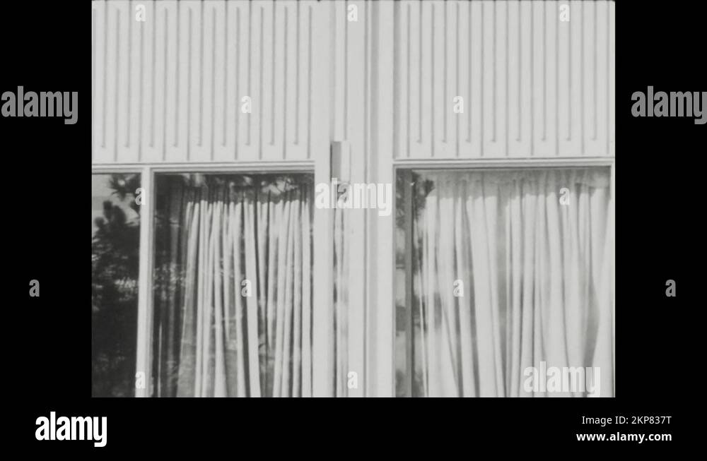 1960s: building facade with windows, columns and curtains, building ...