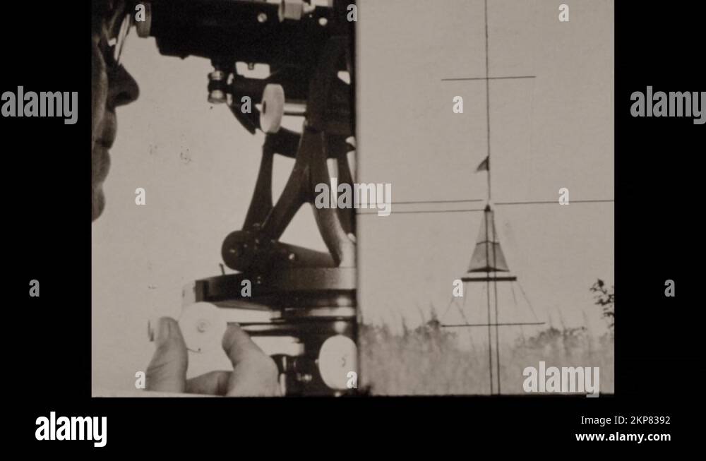 1960s: Man looking through theodolite in field. View through viewfinder ...