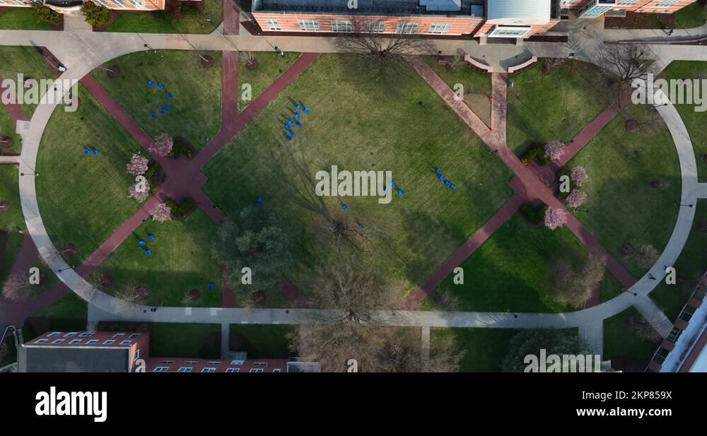 Green University campus grounds. Rising top down aerial birds eye view ...