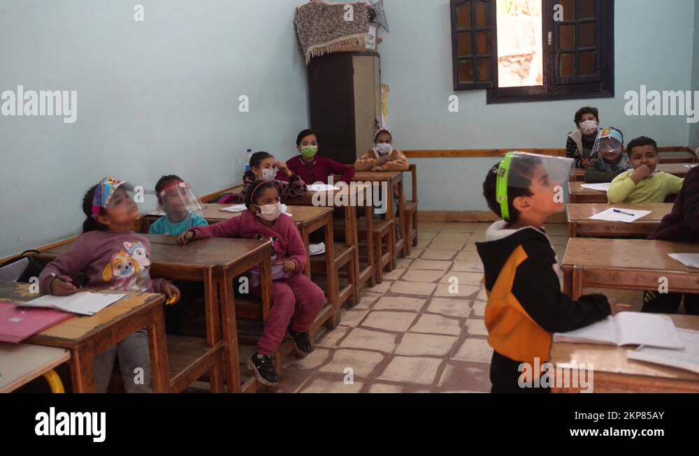 Coptic Christian children in Egypt wearing face masks and shields due ...
