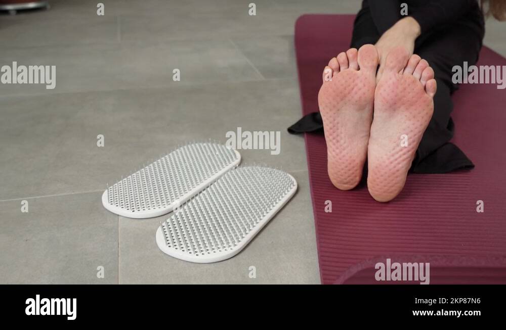 female feet with imprints after standing on nails. next to the sadhu ...