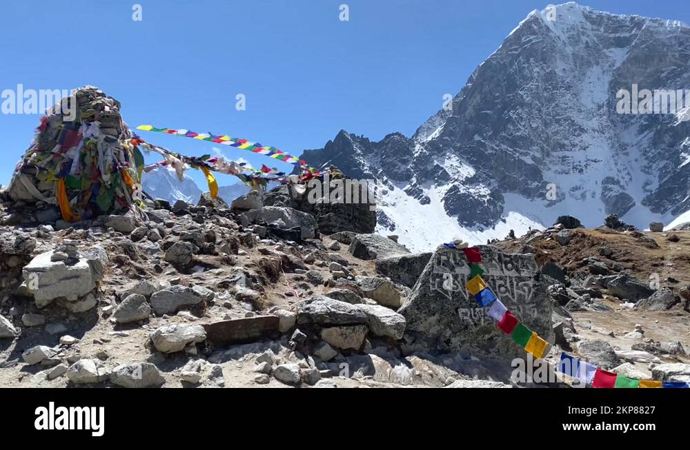 Prayer flags blowing in the wind on the trek to Everest Base Camp in ...