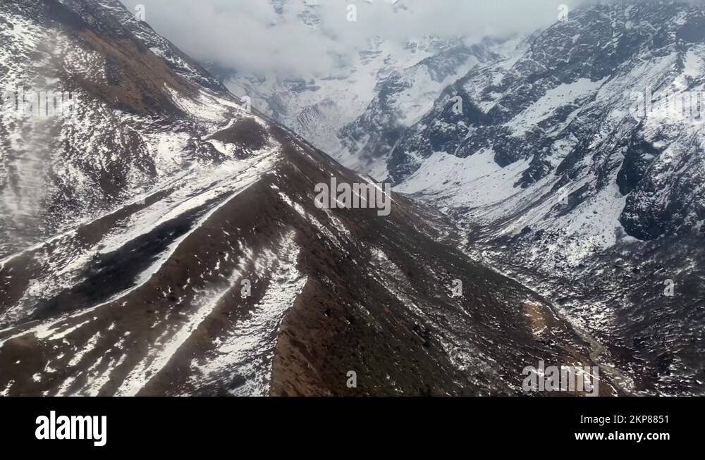 Flying through the rugged terrain of the Himalaya Mountains in Nepal with Stock Video Footage ...