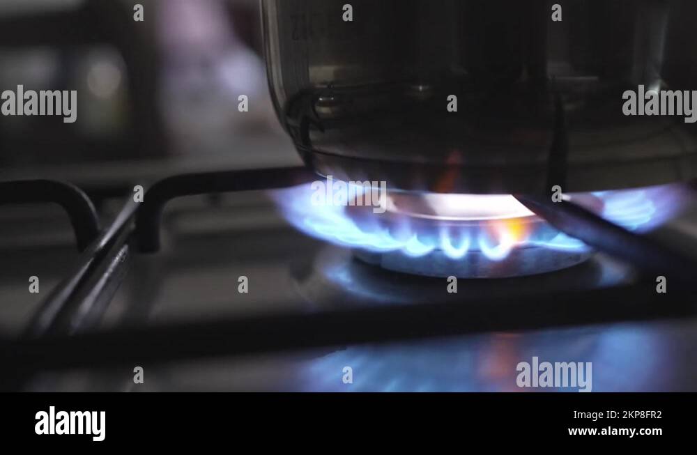 saucepan in a fire on the burner of the gas stove. the energy crisis ...