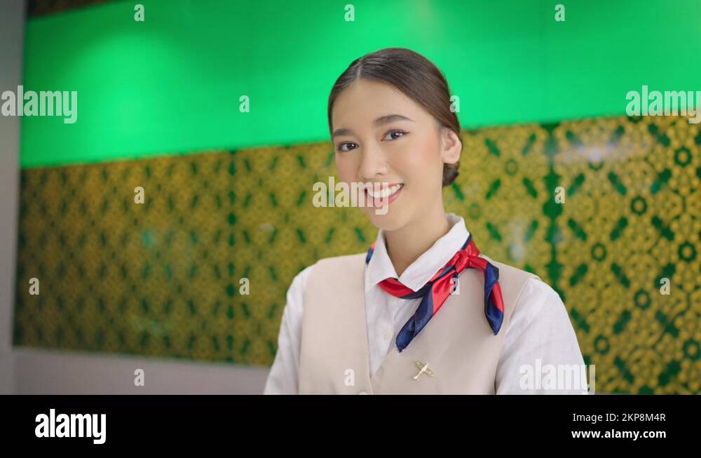 Asian female airline worker stewardess in aviation air hostess uniform ...