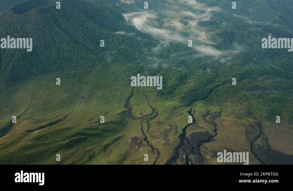 Costa Rica jungle on base of Arenal volcano, aerial, alluvial fans ...