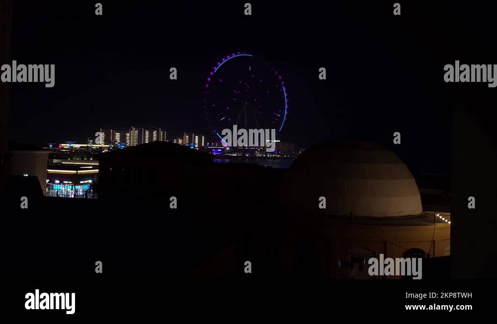 A wide Night view of the Dubai Eye with light show - the largest ...