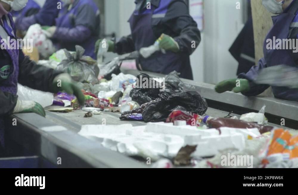 Waste sorting. Conveyor for sorting waste. Recycling garbage Stock ...