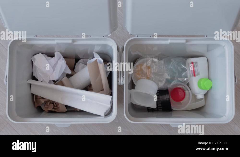 Stop motion animation: sorting of garbage in two recycling bins - top view Stock Video Footage ...