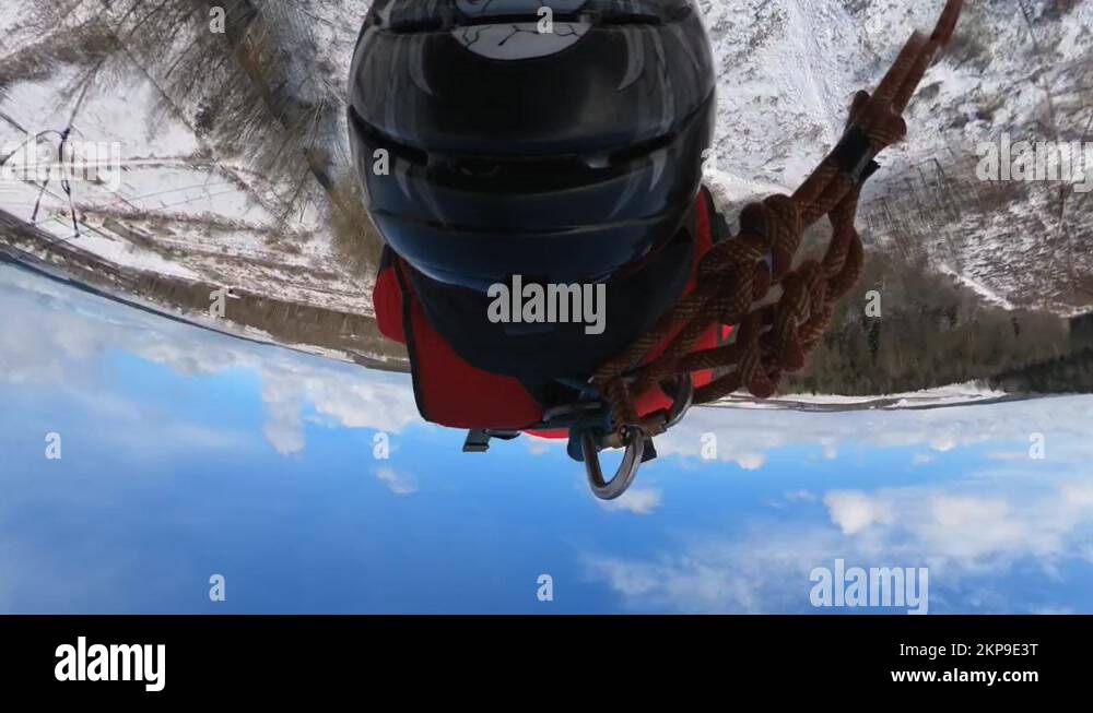 a guy jumps from a tower, a man falls from a height, rope jumping Stock ...