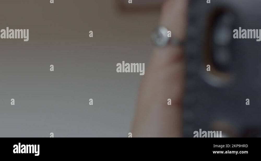 man uses radio receiver listen radio wave. He put device ear listening ...