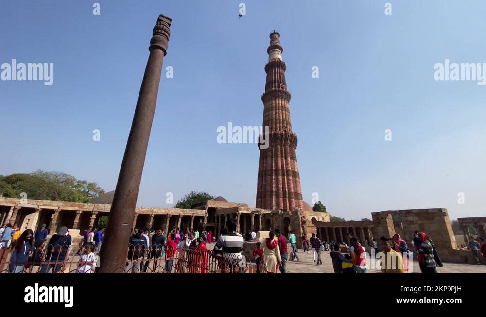 Qutub Minar and its ruins at Qutub complex; famous for its architecture ...
