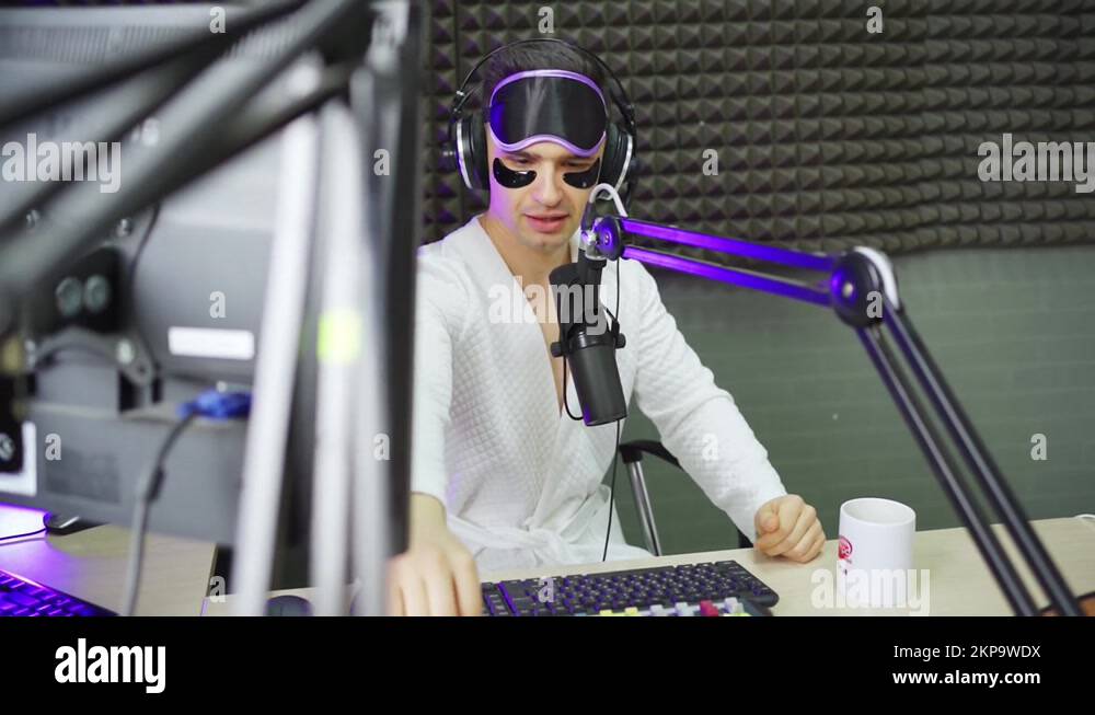 radio host in sleep mask and cosmetic patches on broadcast Stock Video ...
