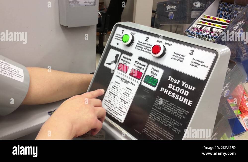 Woman taking her blood pressure inside Walmart pharmacy section Stock ...