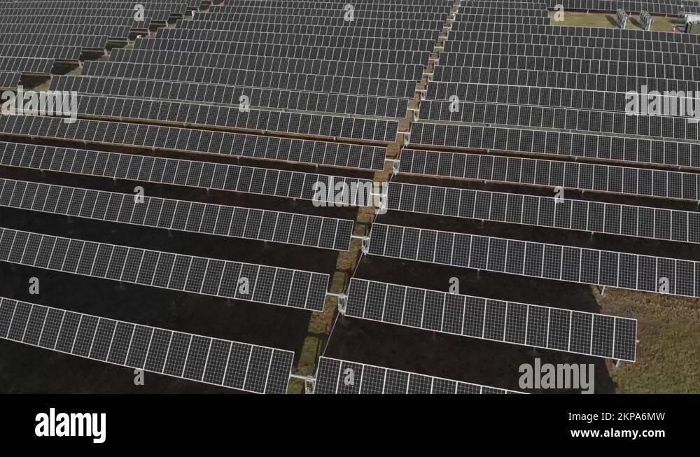 Sunlight Reflects On Solar Panels Array In A Rural Farm In Western ...