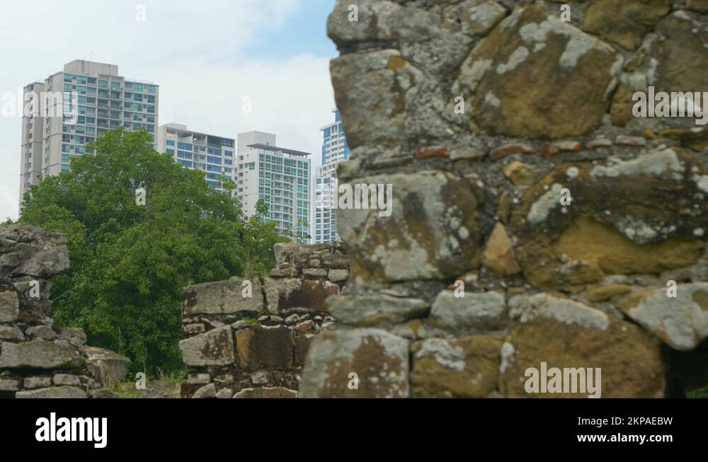 CLOSE UP: Modern high rise buildings overlook the ruins of Panama Viejo ...