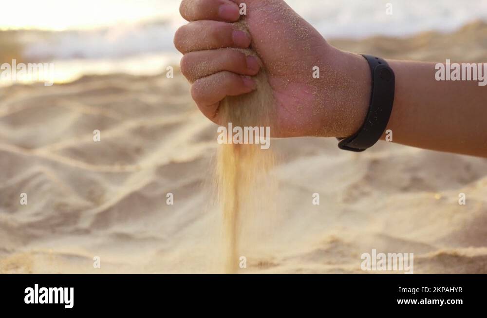 Male hands hold sand to sprinkle at Phu Quoc island, Vietnam. Man's ...