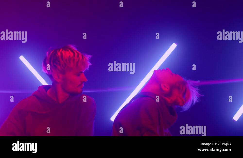 Trendy couple performing dance in nightclub closeup. Girl dancing with ...