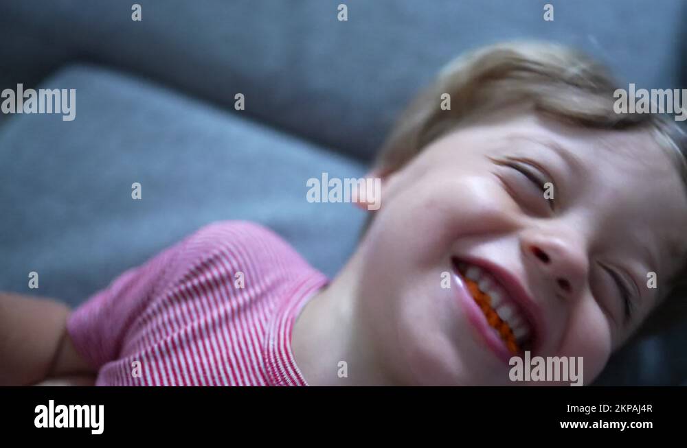 Tickling one little boy happy face closup Stock Video Footage - Alamy