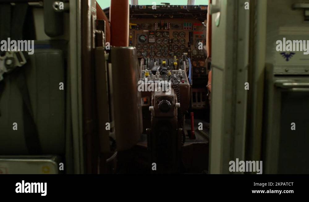 Dolly-back of an airplane cockpit with a green screen backdrop outside ...