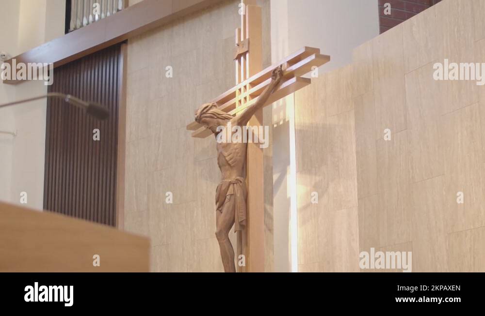 A dynamic footage of a church crucifix moving towards the left ...