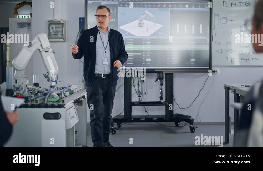 Lecturer Pointing At Big Screen And Telling Stock Video Footage - Alamy