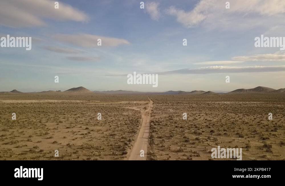 Sandy road, feald of kali tragus the russian thistle. Dramatic aerial ...