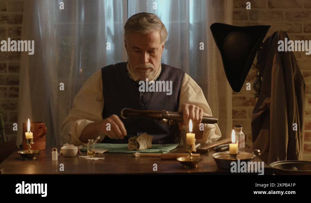 18th century man polishing a flintlock pistol Stock Video Footage - Alamy