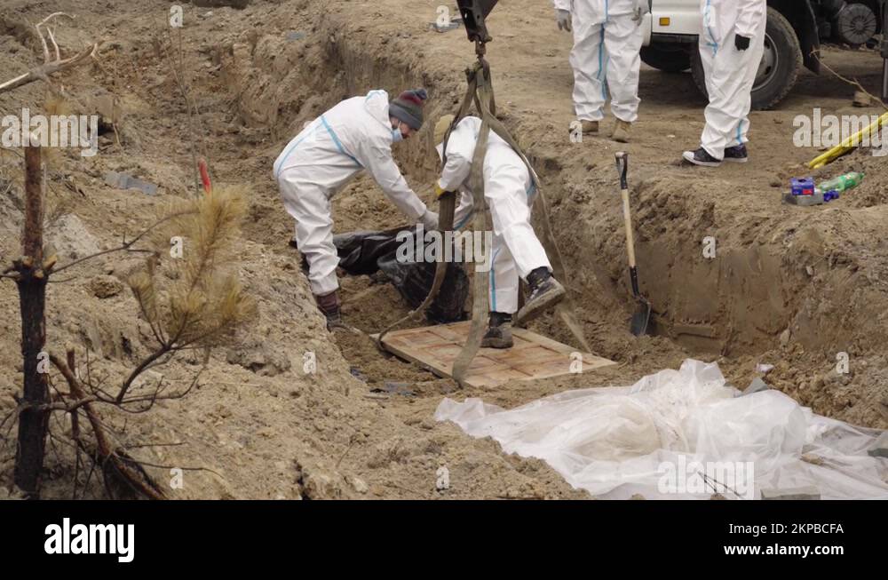 Excavation of a mass grave in Bucha Stock Video Footage - Alamy