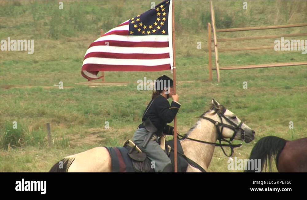 Civil War Union Cavalry Re-enactor with flags, gallop into battle Stock ...