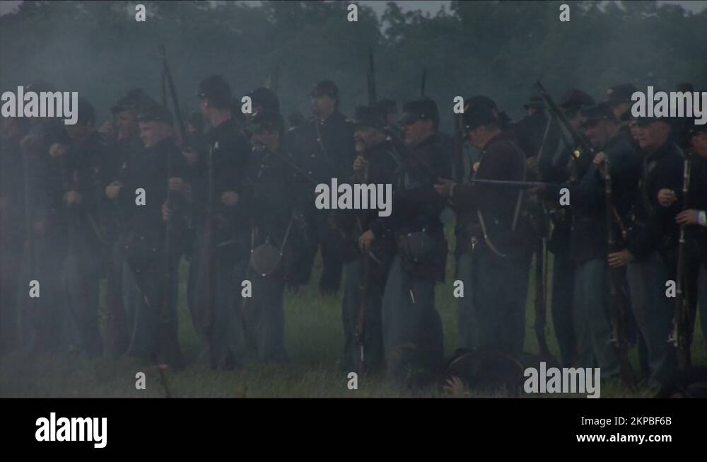 Civil War Union Re-enactor soldiers firing muskets and fighting in ...