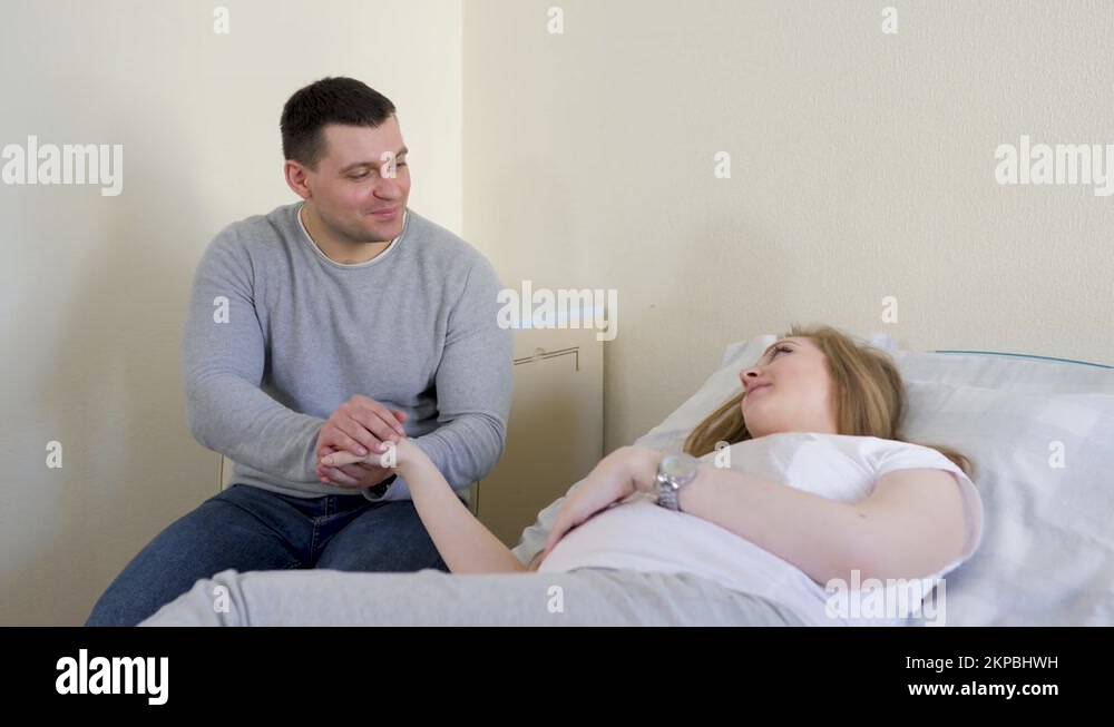 The Husband Holds His Wifes Hand Visits His Pregnant Wife In A
