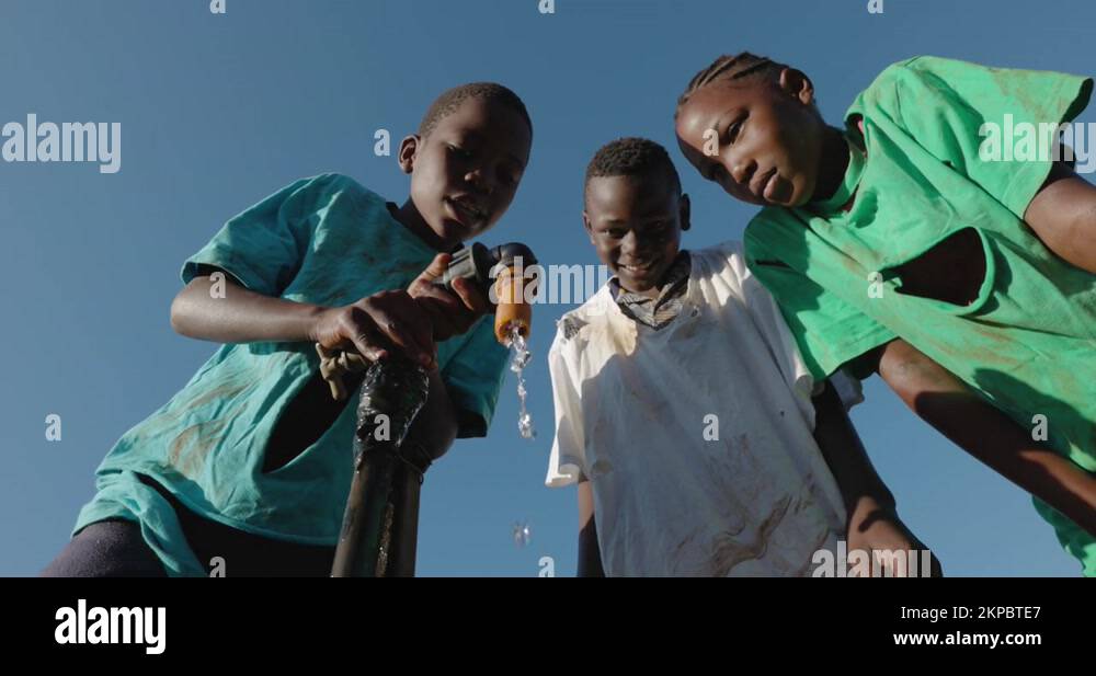 Poverty.Water crisis.Drought.Close-up black African children waiting ...