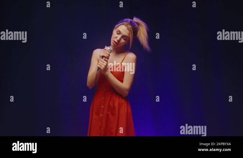 Stand-up cafe, comedy concert. Woman telling jokes on stage. Female ...