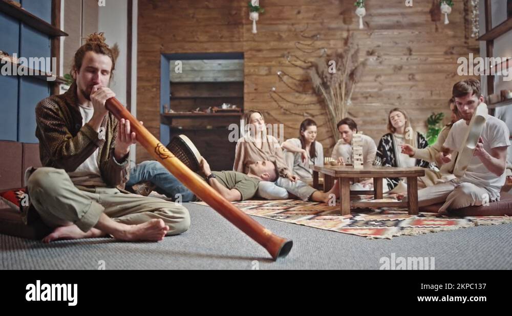 Hippies playing traditional musical instruments together. Group of ...
