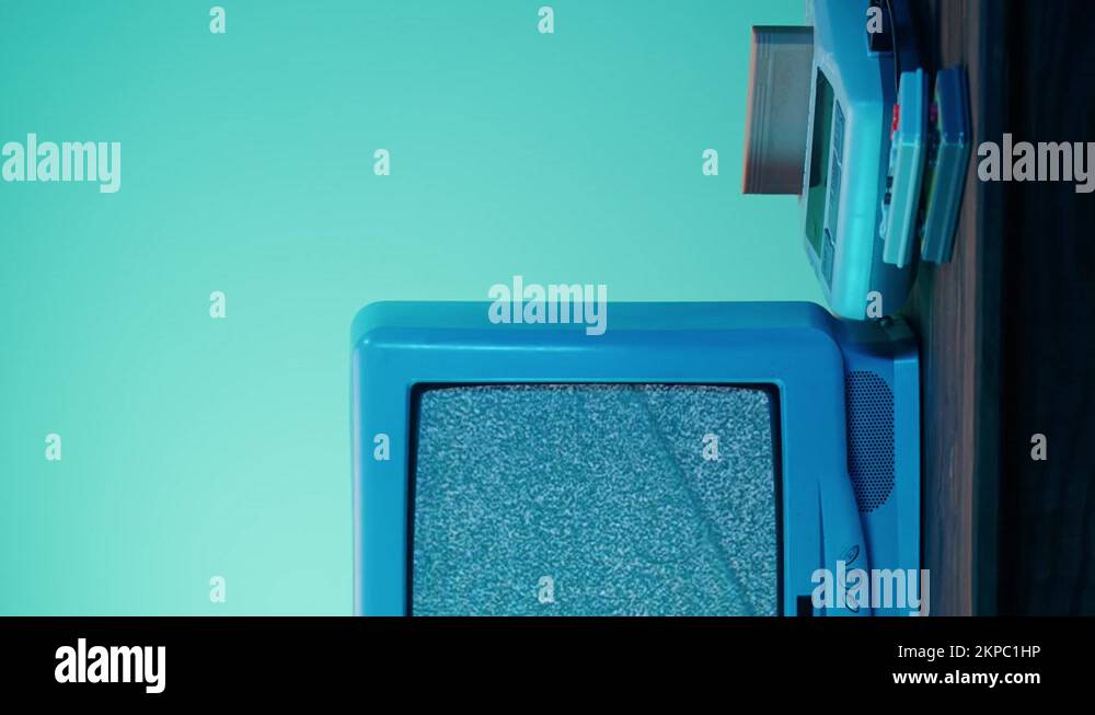 Vertical video of old television with grey interference screen on blue ...