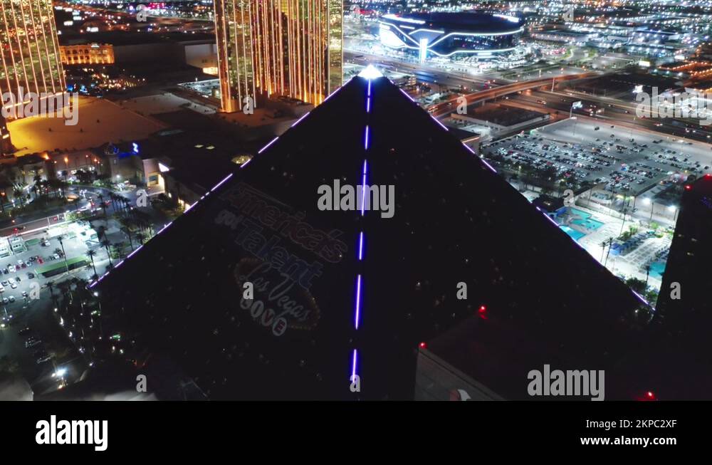 Overhead aerial Luxor hotel Pyramid building, bright light beam into ...