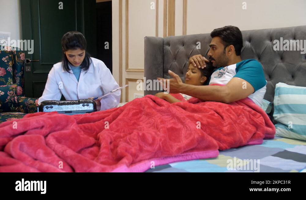 A sick little girl suffering from cough and cold resting with her ...