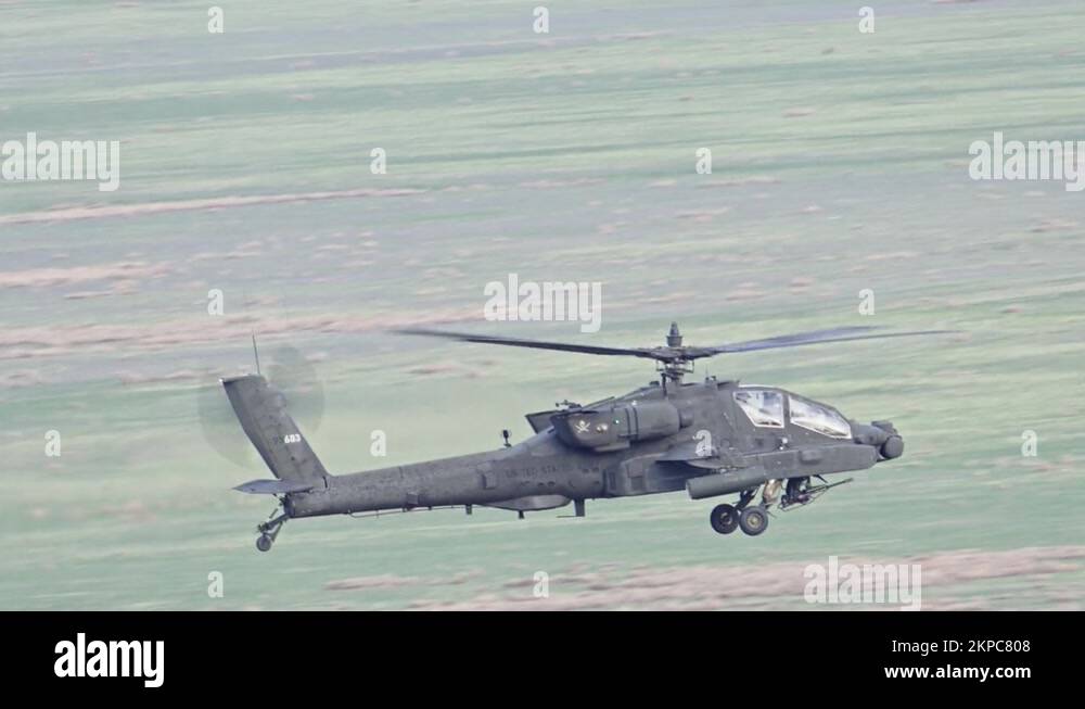 Sikorsky UH-60 Black Hawk flying low over field during training Stock ...