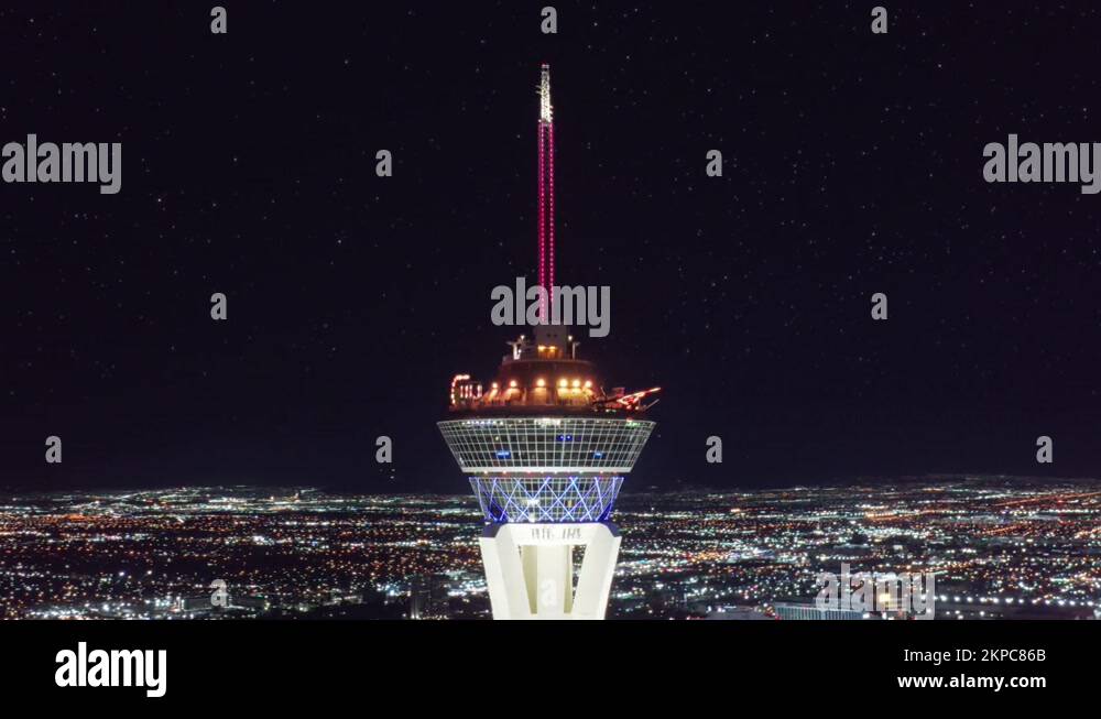 Cinematic aerial the STRAT tower with rides on observation deck, Las ...